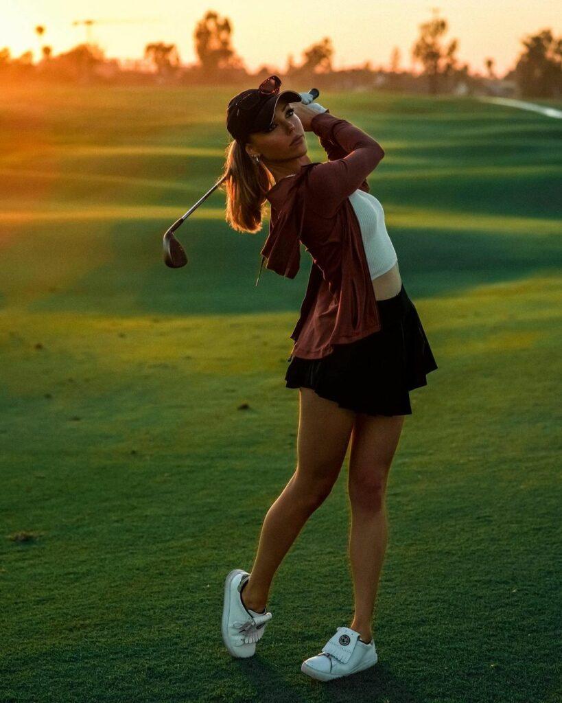 Claire Hogle Puts On A Leggy Display In Short Skirt While Golfing