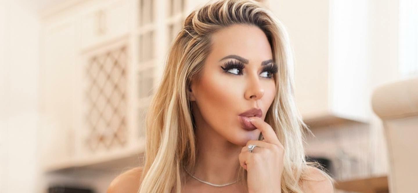 Kindly Myers Hits The Beach In A Pink Thong Bikini