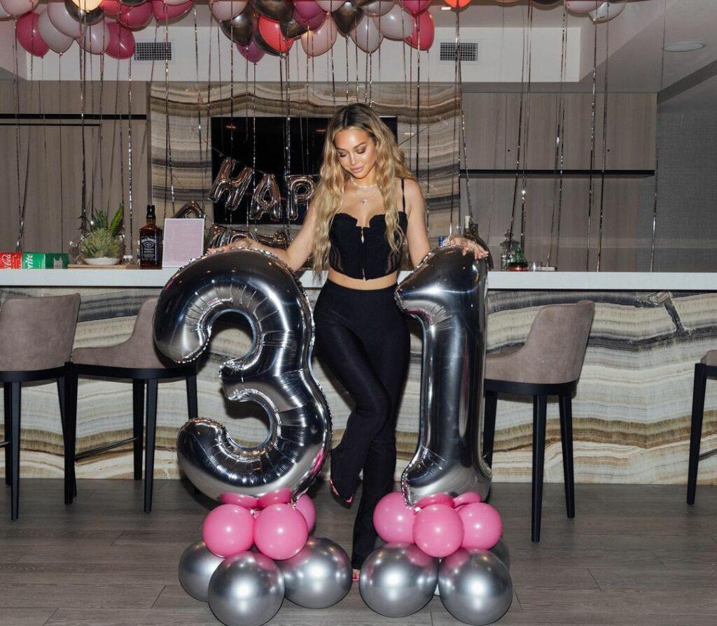 Bombshell Corinne Olympios Celebrates Birthday In Black Outfit