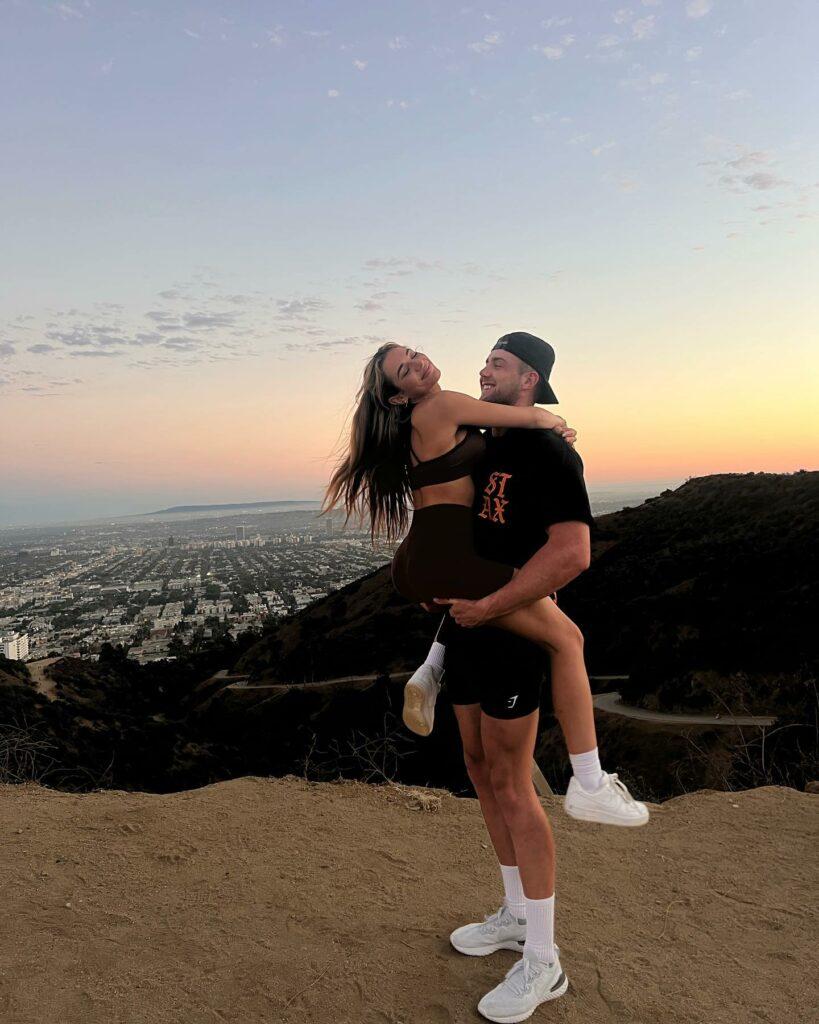 Georgia Hassarati Flaunts Her Sunned Buns In A See-Through Bodysuit