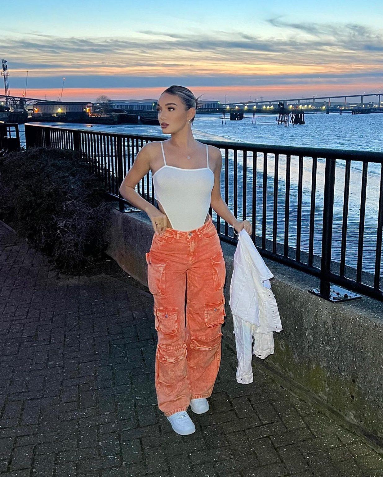 Beaux Raymond Puts On A Busty Display In Her Thin White Bodysuit