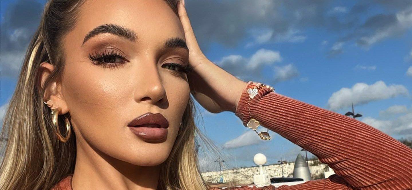 Beaux Raymond Goes Braless In Her Plunging Orange Jumpsuit