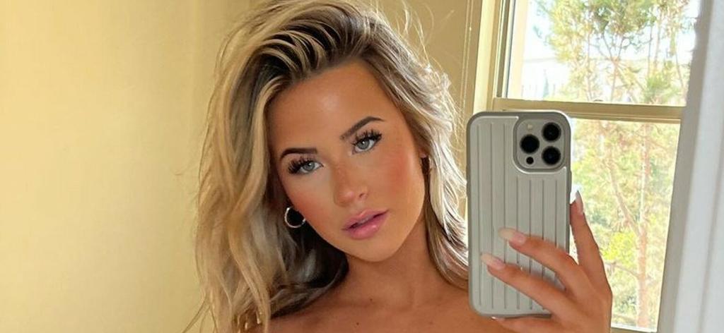Emily Elizabeth Bares Big Assets In Her Neon One-Piece