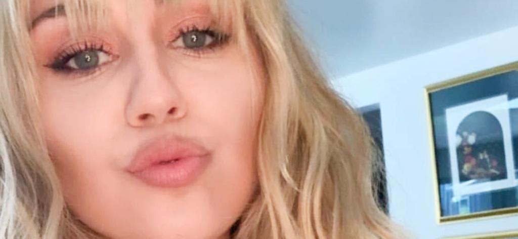 Miley Cyrus Exposes Chest In Fluffy Open Bathrobe