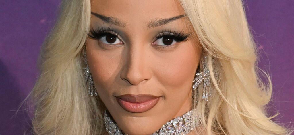 Doja Cat Popping Out Of Lingerie Should 'Sue Whoever Did That Boob Job'