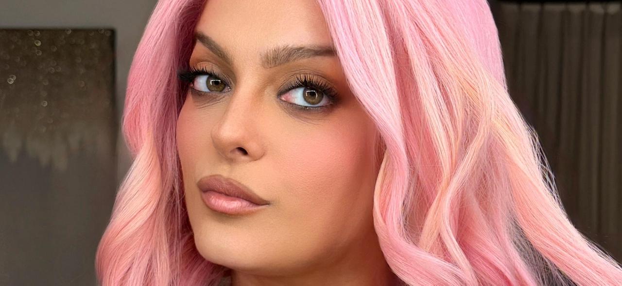 Bebe Rexha In Plunging Swimsuit Highlights Her 'Coconuts'