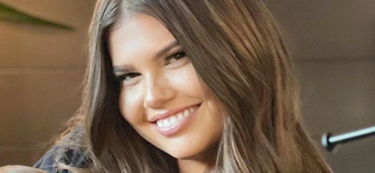 Chanel West Coast In Plunging Poolside Swimsuit Shows Merch