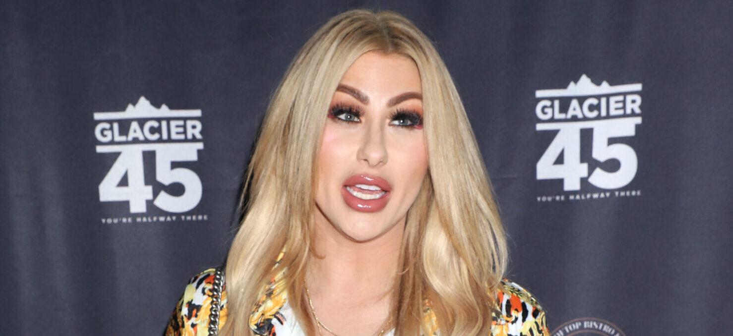 Melanie Martin Stuns In Plunging Black Gown While On A Stroll