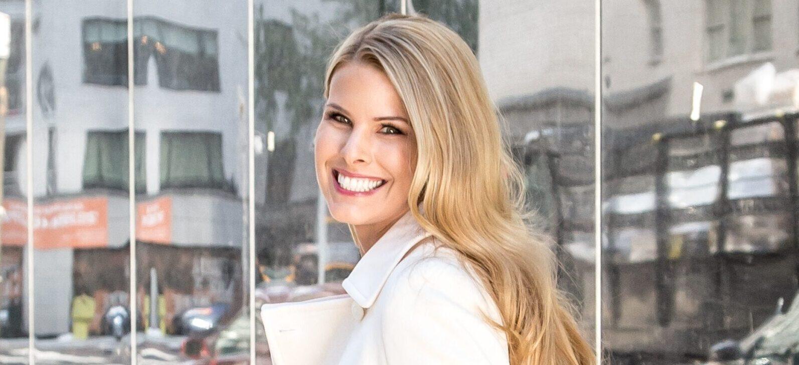 Howard Stern's Wife Beth Drops Jaws In Her Plunging Neon Pink Swimsuit