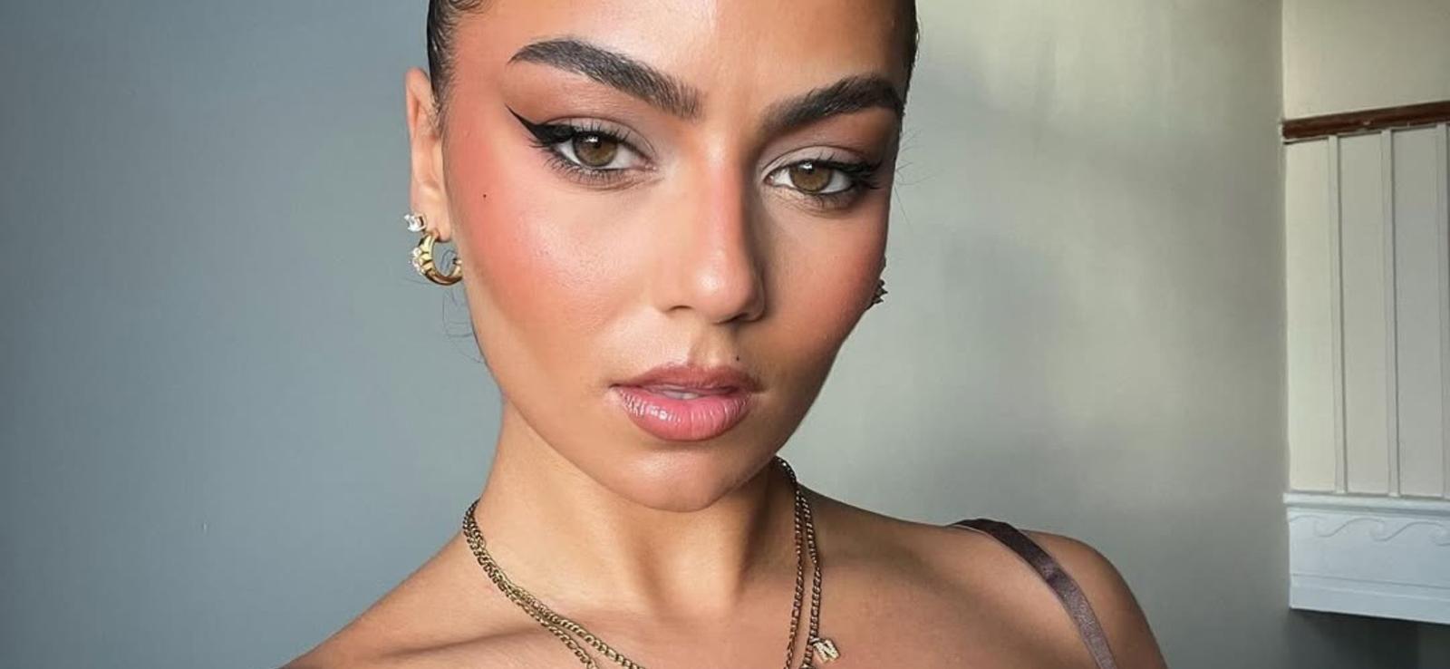 Megan Forte Clarke Drops Jaws In Bold, Chest-Baring Sheer Gown