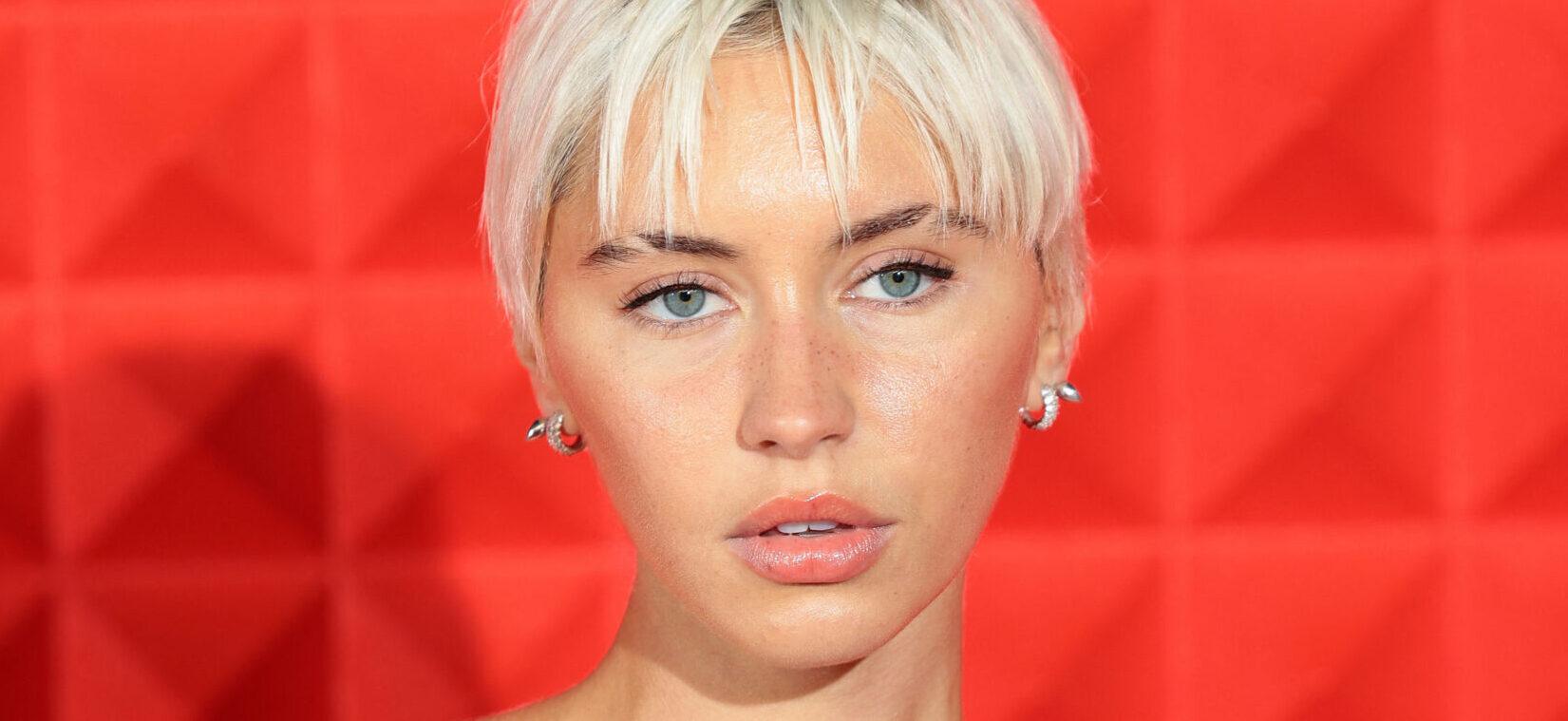 Iris Law Showcases A Leggy Display In Tight Black Swimsuit