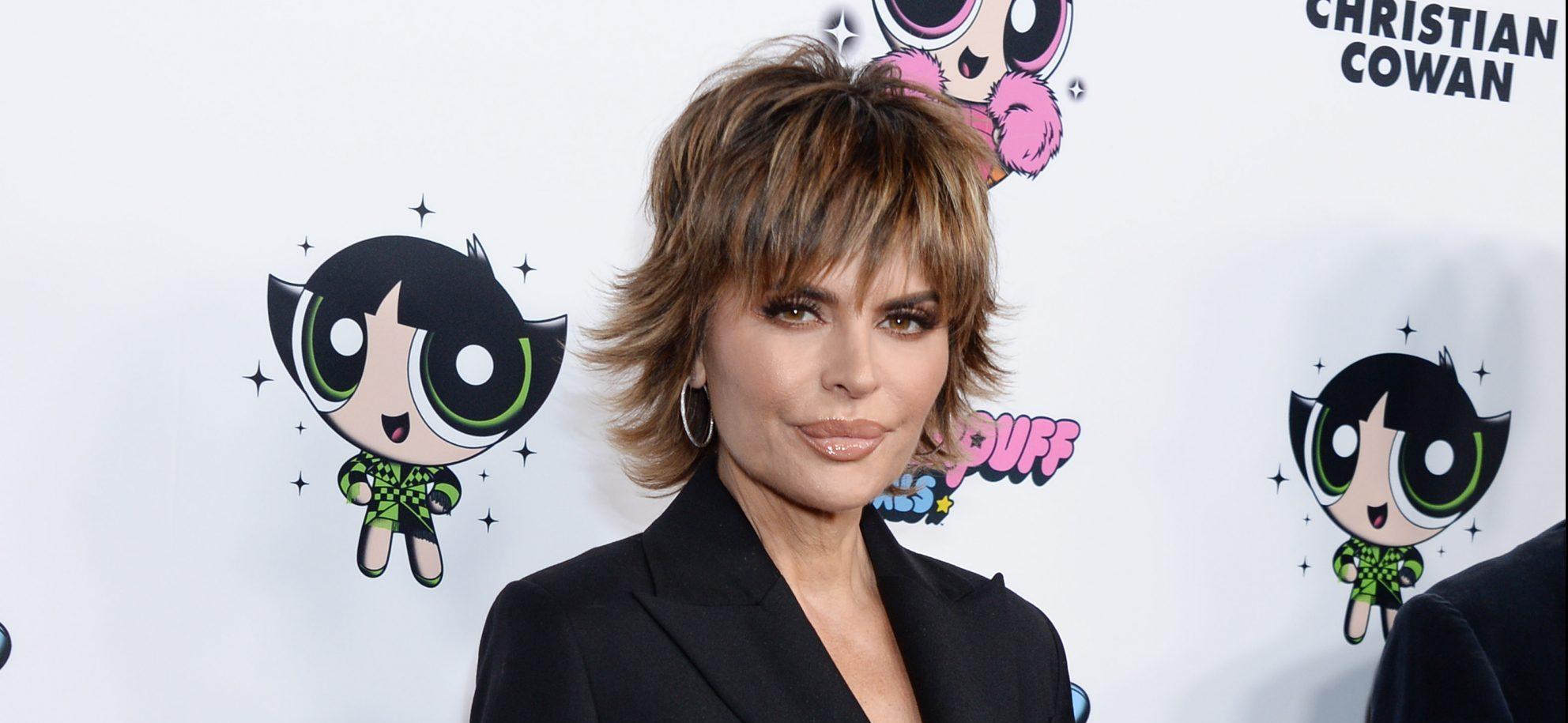 Lisa Rinna Rocks A Plunging Dress To Promote Her New ‘Lip Kit’