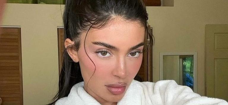 Kylie Jenner Promotes Sprinter In Her High-Cut Metallic Swimsuit