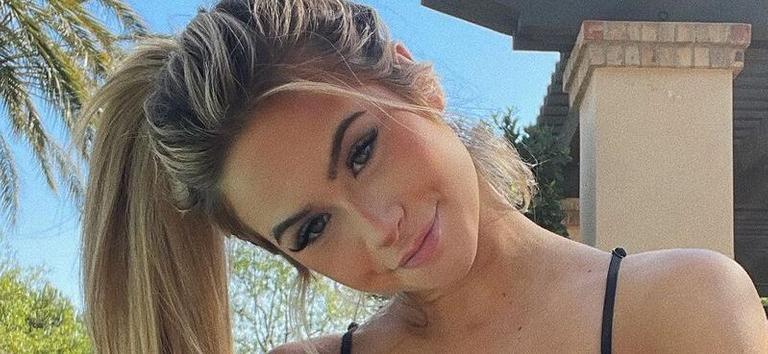 Emily Elizabeth Showcases Busty Side View In Her White Swimsuit