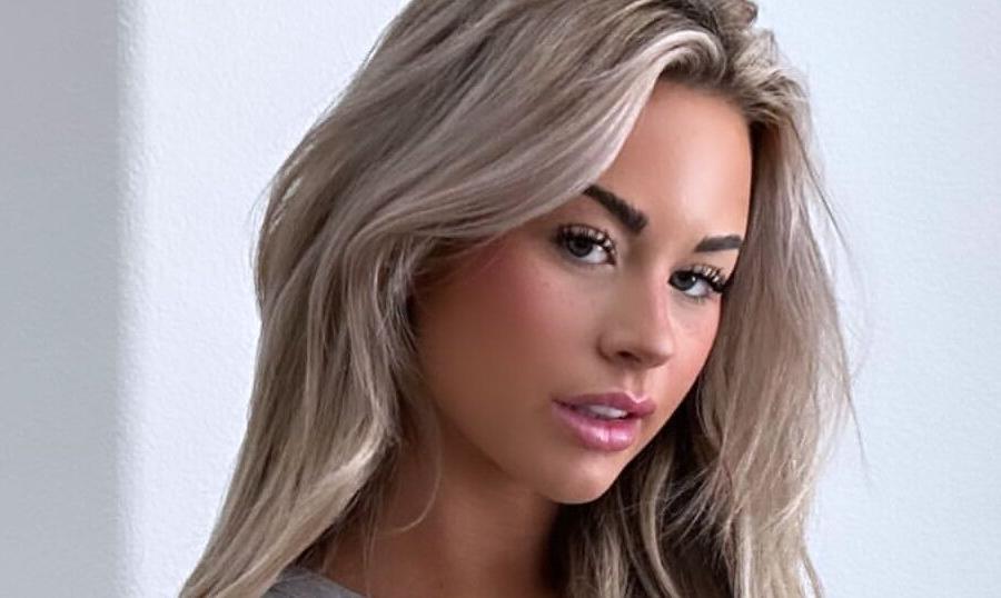 Emily Elizabeth Gives A Cheeky Display In Black And White Bikini