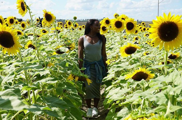 Simone Biles Flashes Chest Piercing While Stunning In Sunflower Field ...